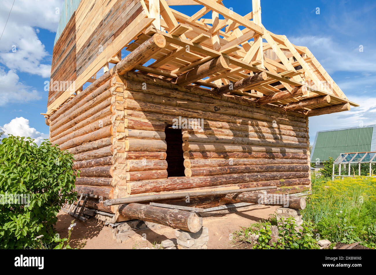 Wooden house under construction Stock Photo - Alamy