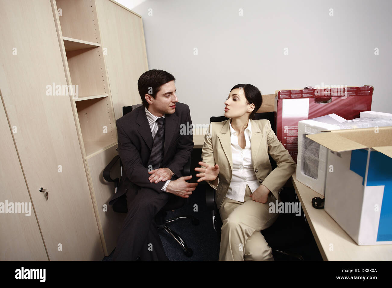 Business people in office with boxes Stock Photo - Alamy