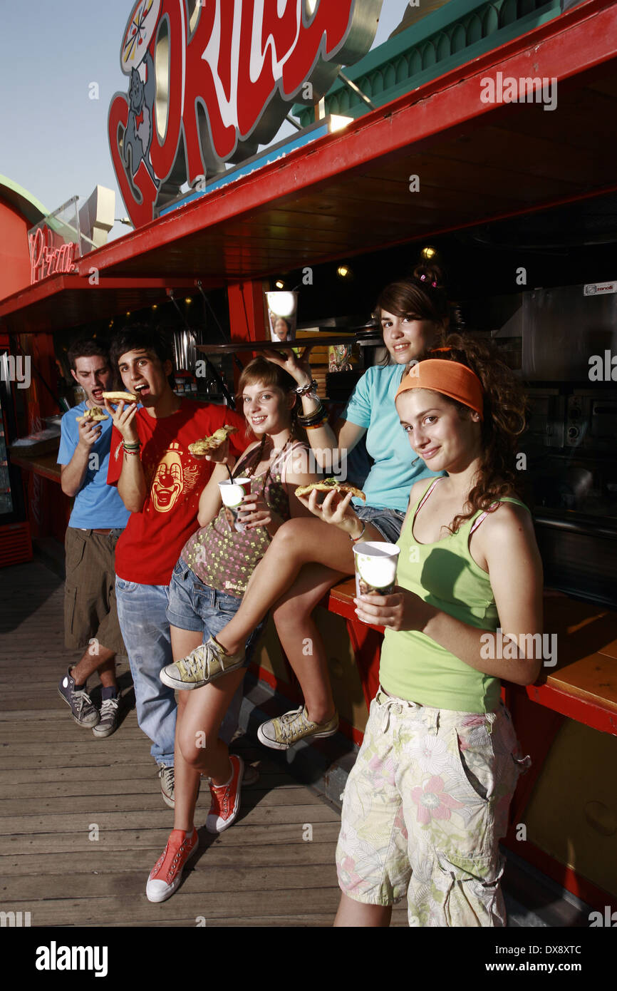 Teenagers hanging out, eating pizza Stock Photo - Alamy