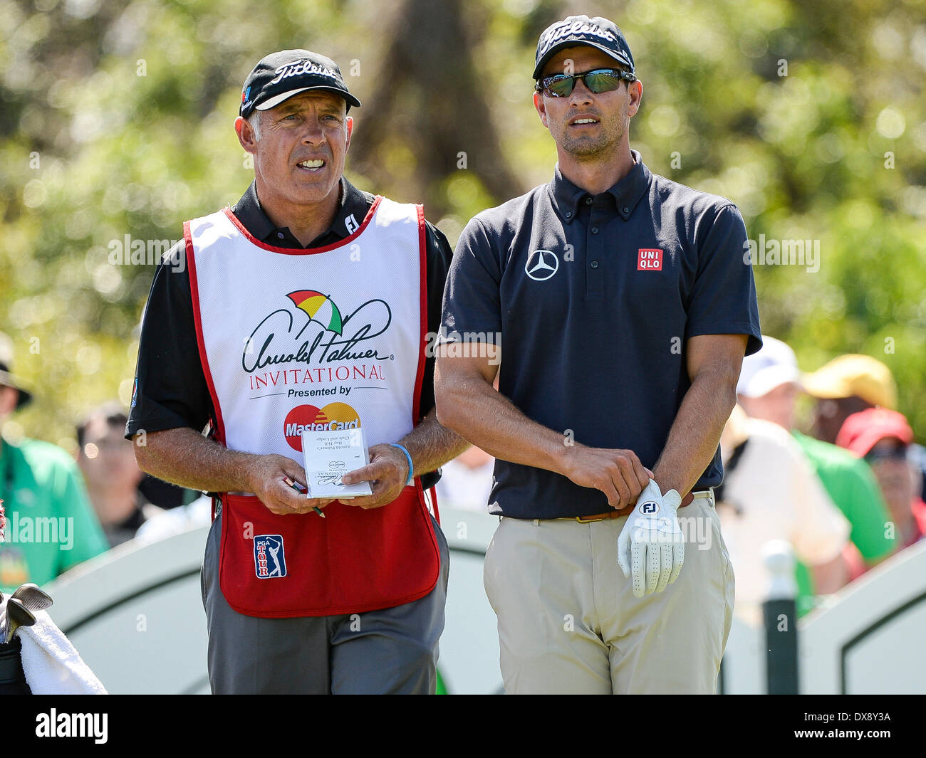 Orlando, Florida, USA. 20th March 2014. Adam Scott gets yardage info ...