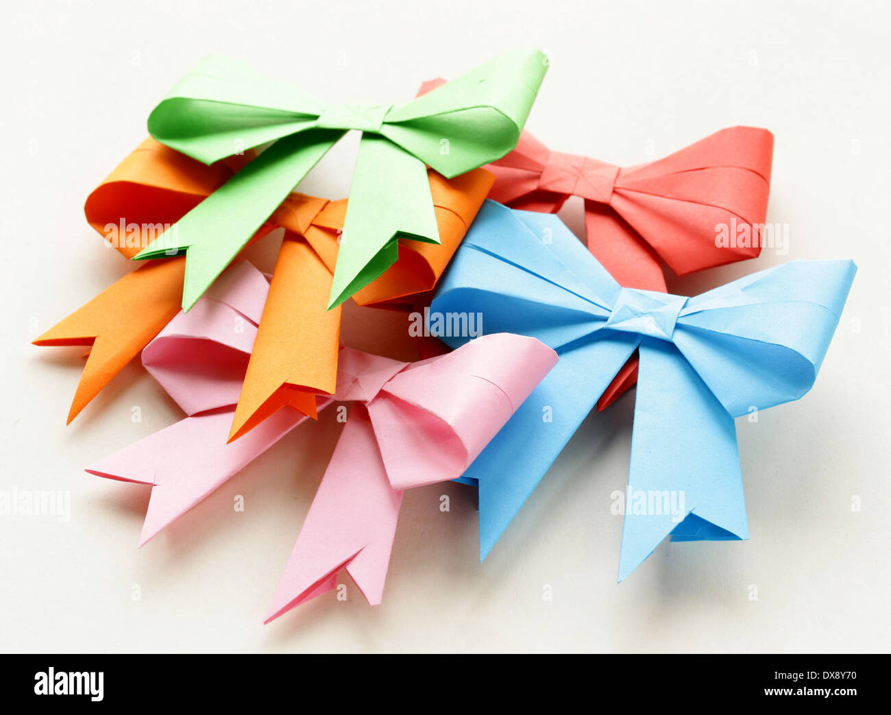 colored paper origami bows for holiday cards Stock Photo - Alamy