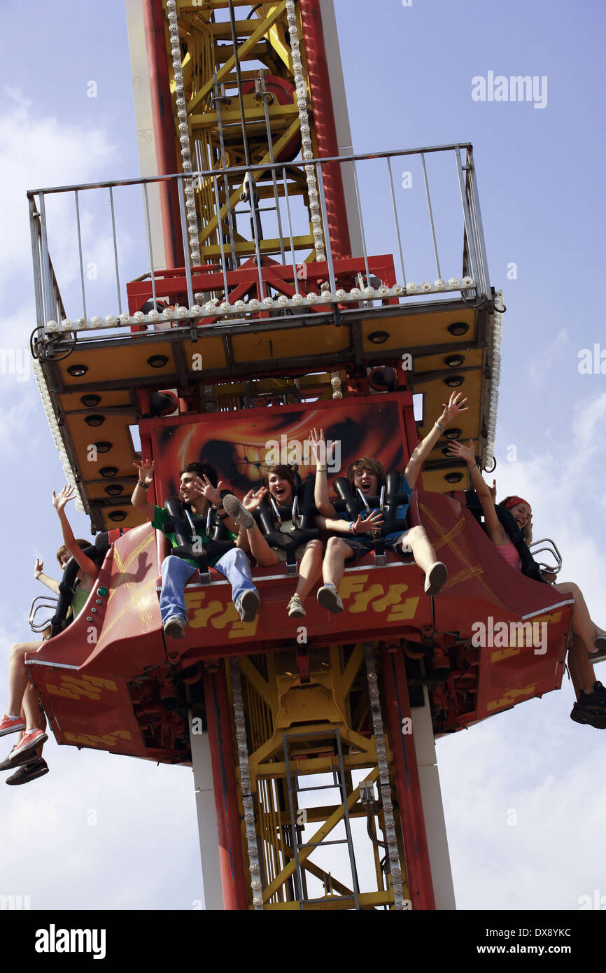 Teenagers on amusement park ride Stock Photo - Alamy