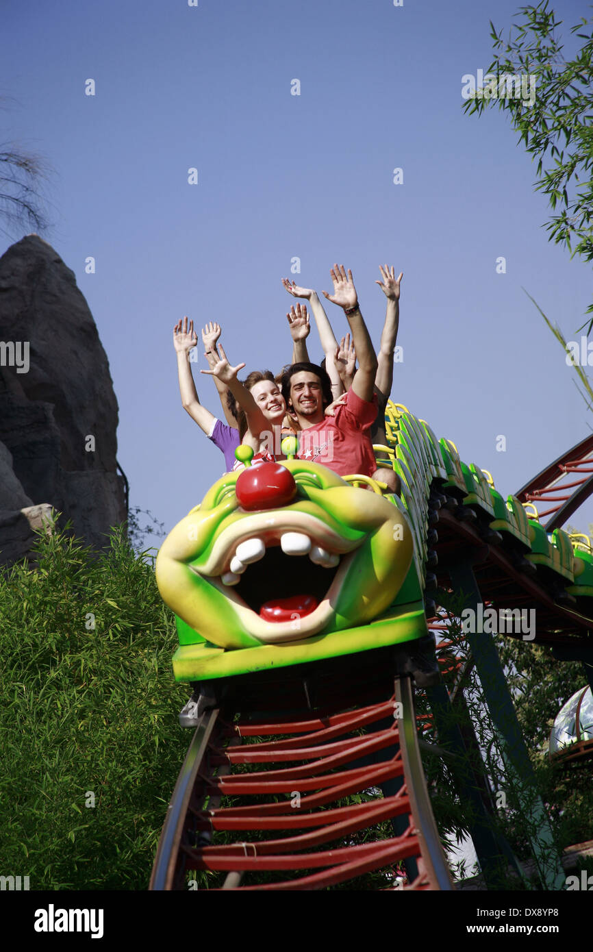Teenagers on amusement park ride Stock Photo - Alamy