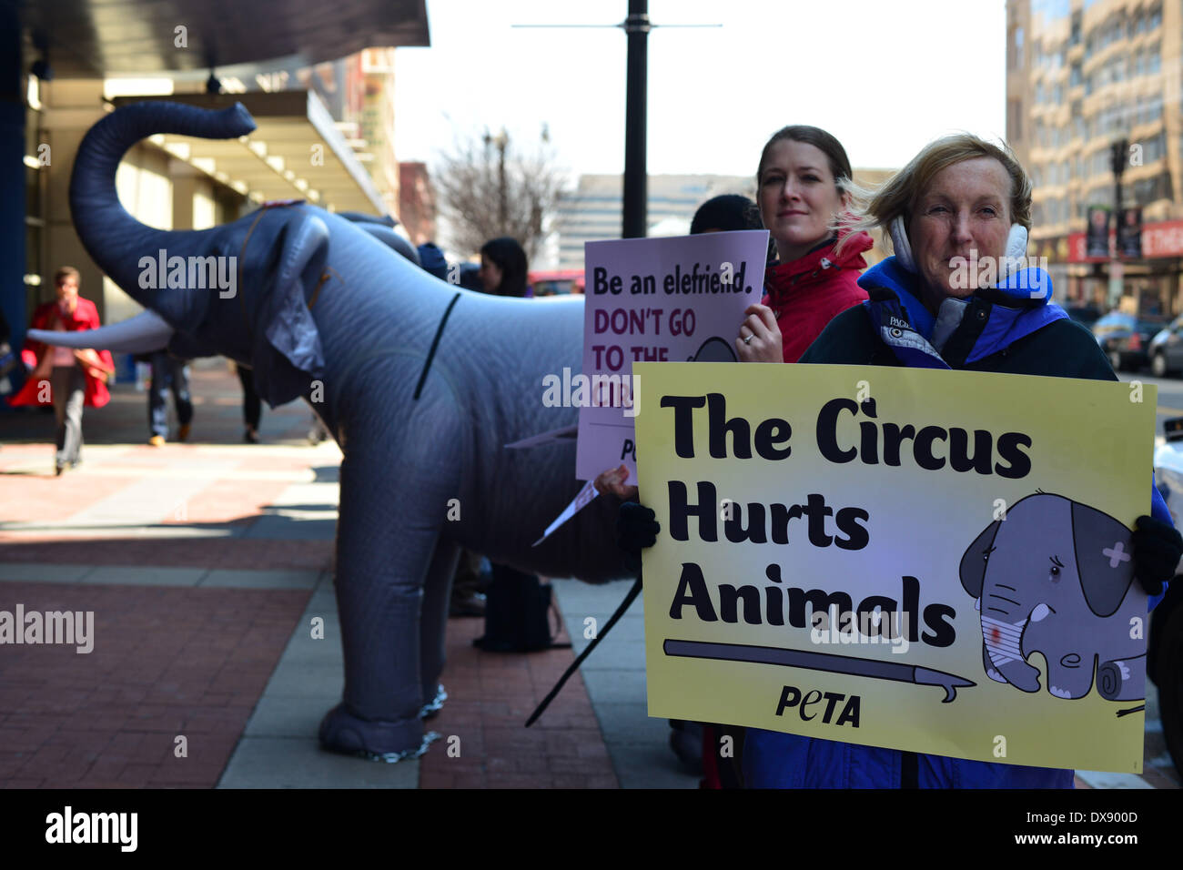 Washington DC, USA. 20th March 2014. Peta activists hold banners during ...