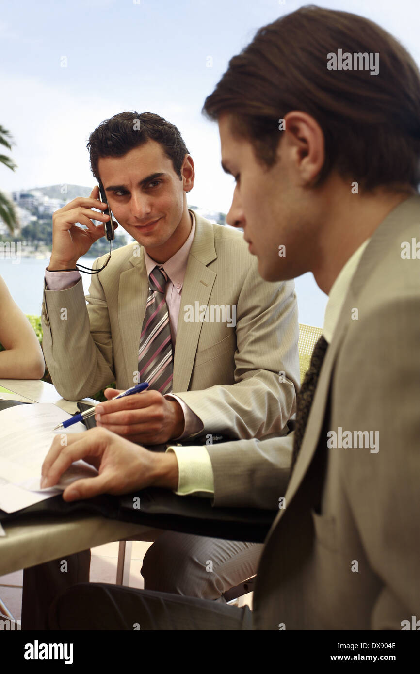 Two men at a meeting by the sea Stock Photo - Alamy