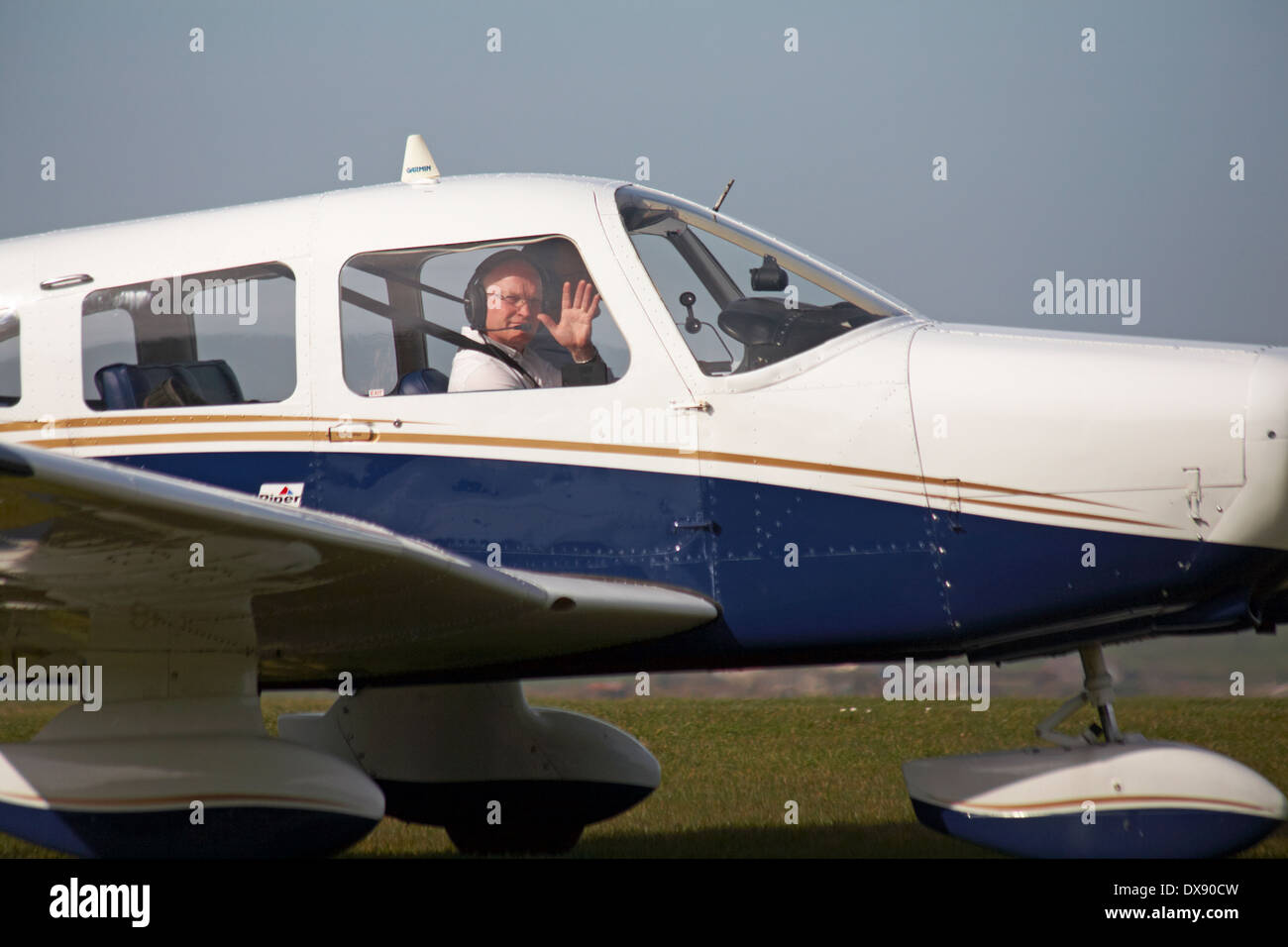pilot waving from light aircraft at Compton Abbas airfield, Dorset in ...