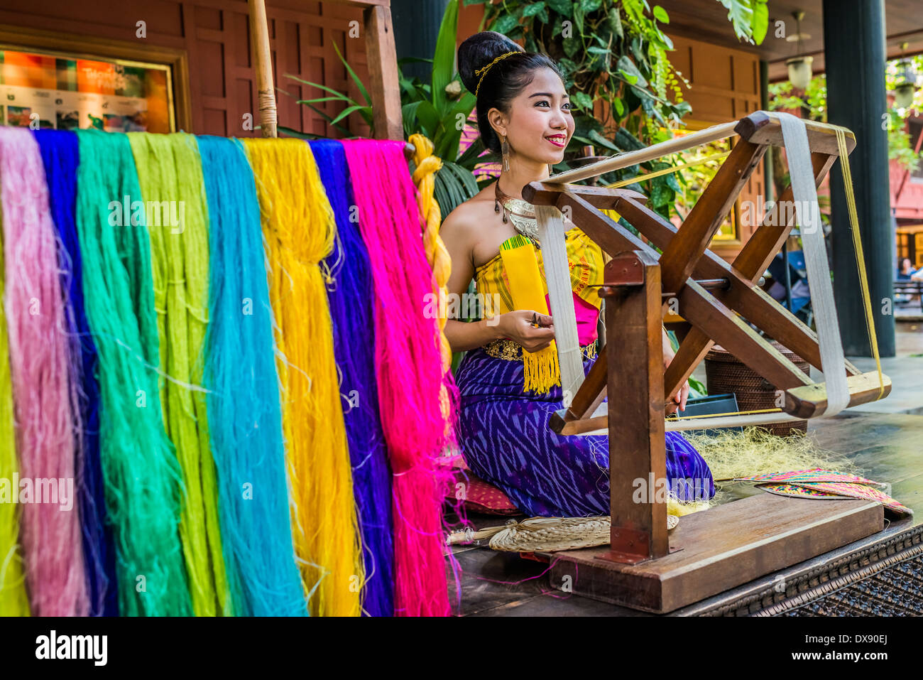 Bangkok, Thailand - December 28, 2013: woman spinning silk at Jim ...