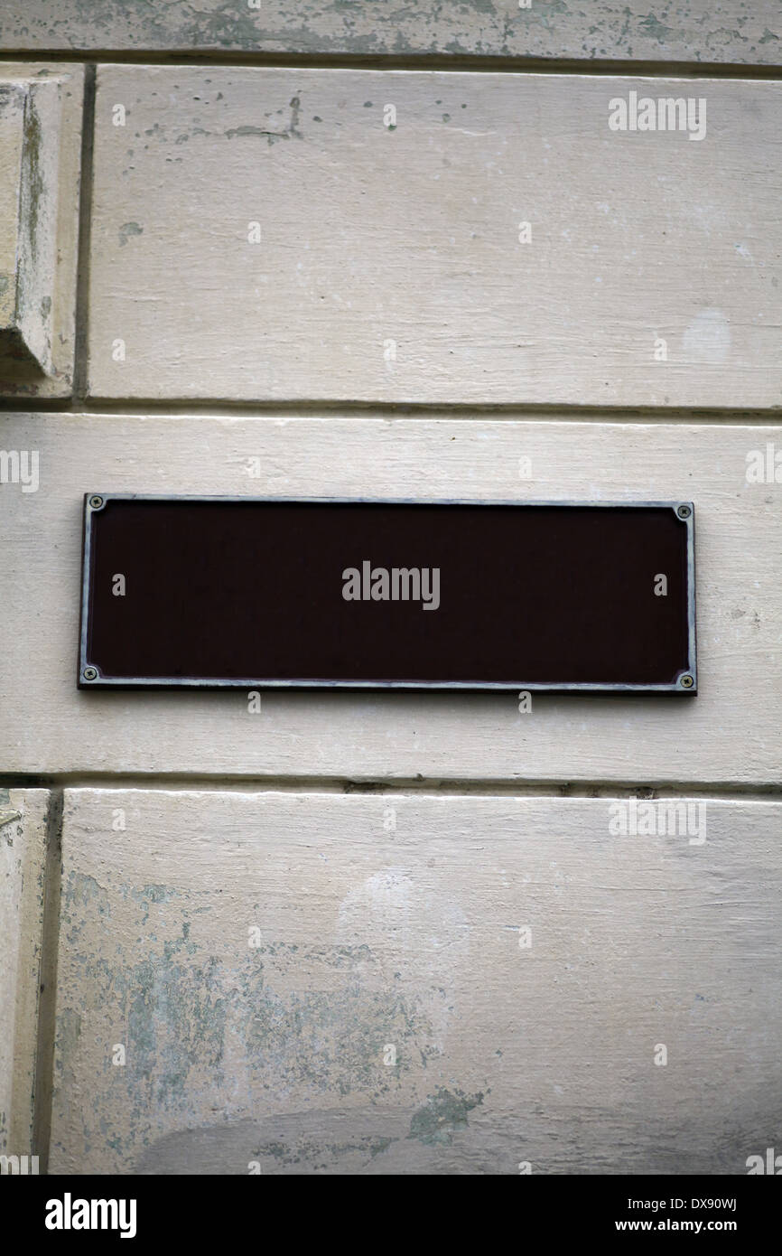 Color shot of an empty blue street sign on a wall Stock Photo - Alamy
