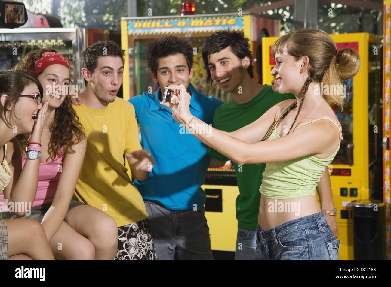 Teenagers hanging out in arcade Stock Photo - Alamy