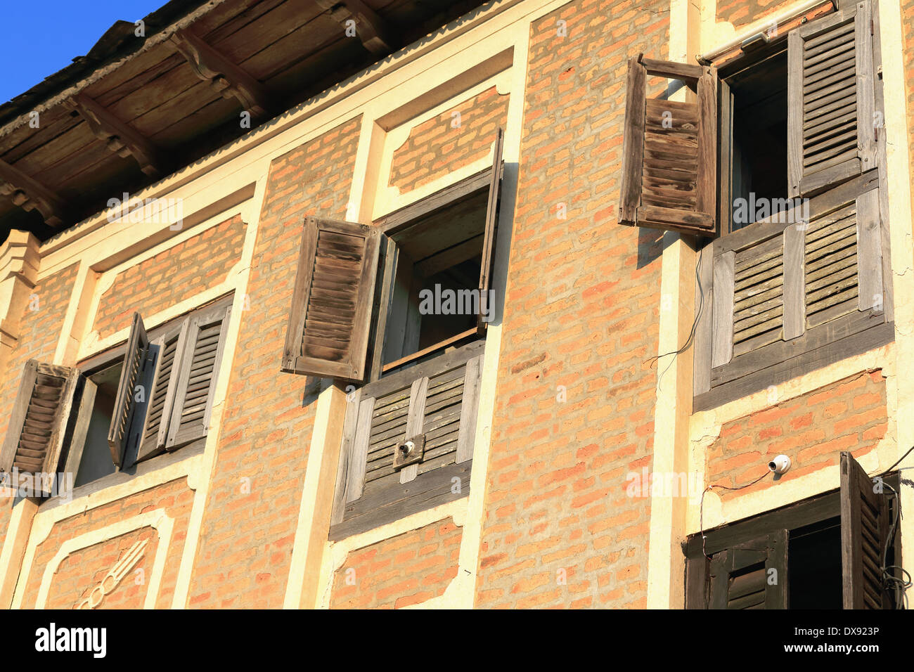 Red brick traditional house of the newari style with dark wood windows ...