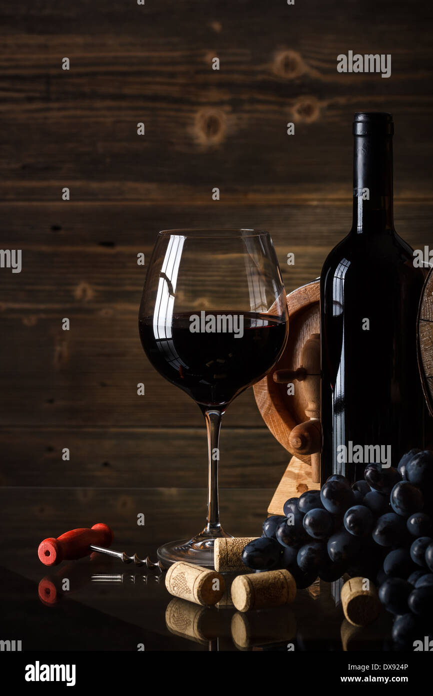 Still life with red wine, bottle and barrel Stock Photo - Alamy