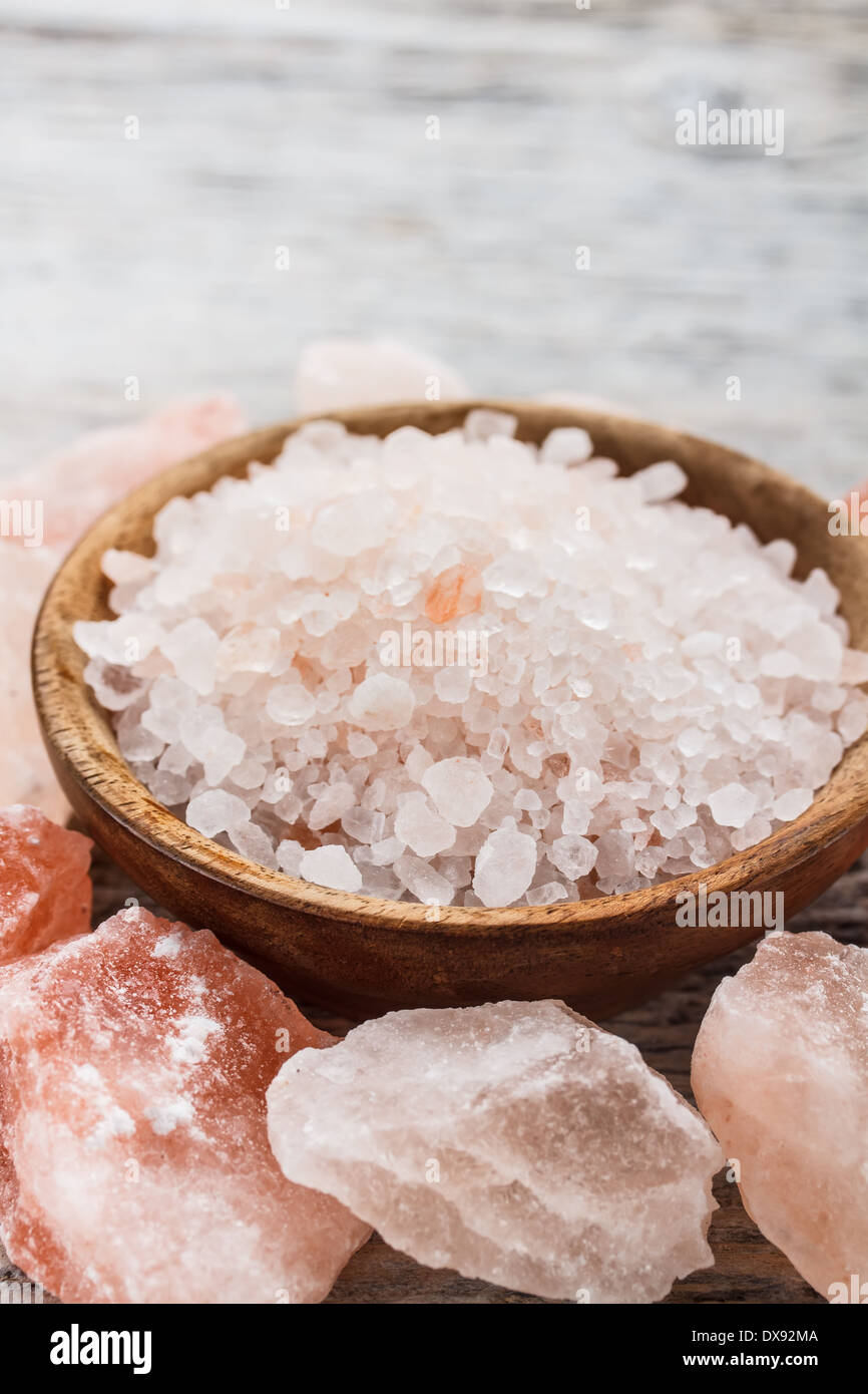 Himalayan pink salt in wooden bowl Stock Photo - Alamy