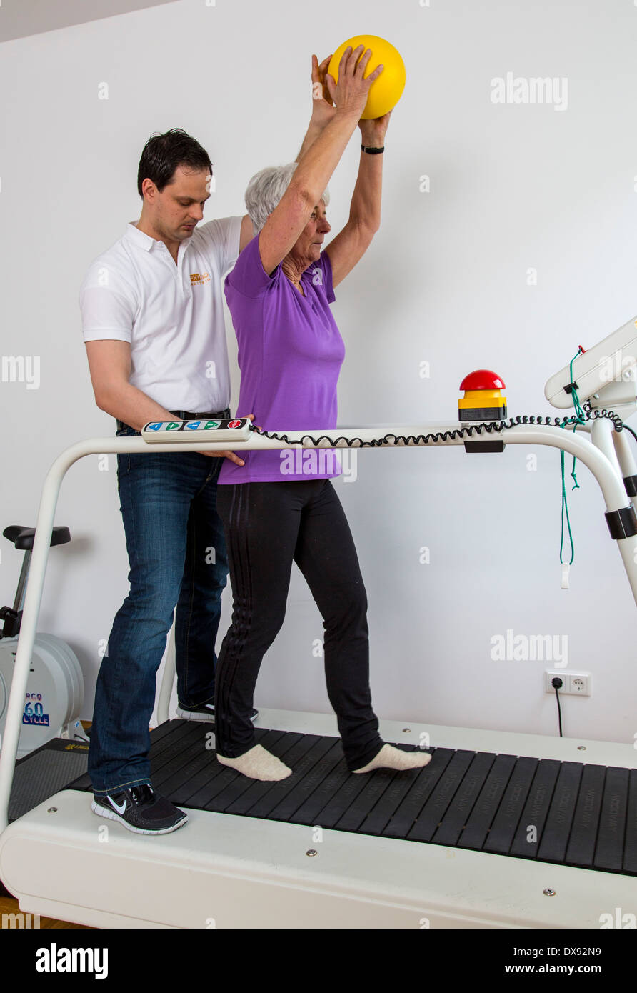 Physiotherapy practice therapist with patient, gait training, running ...