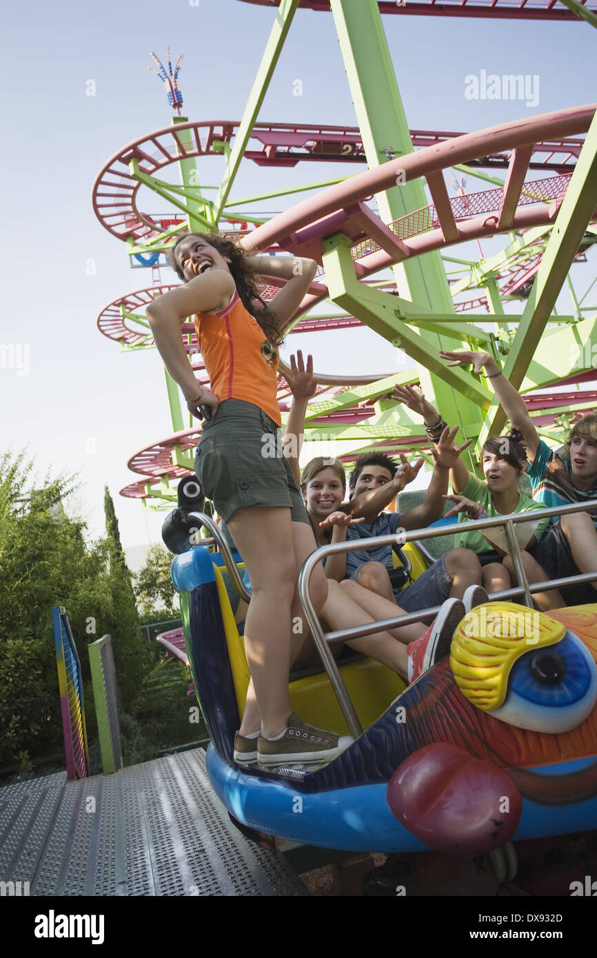 Teenagers on amusement park ride Stock Photo - Alamy