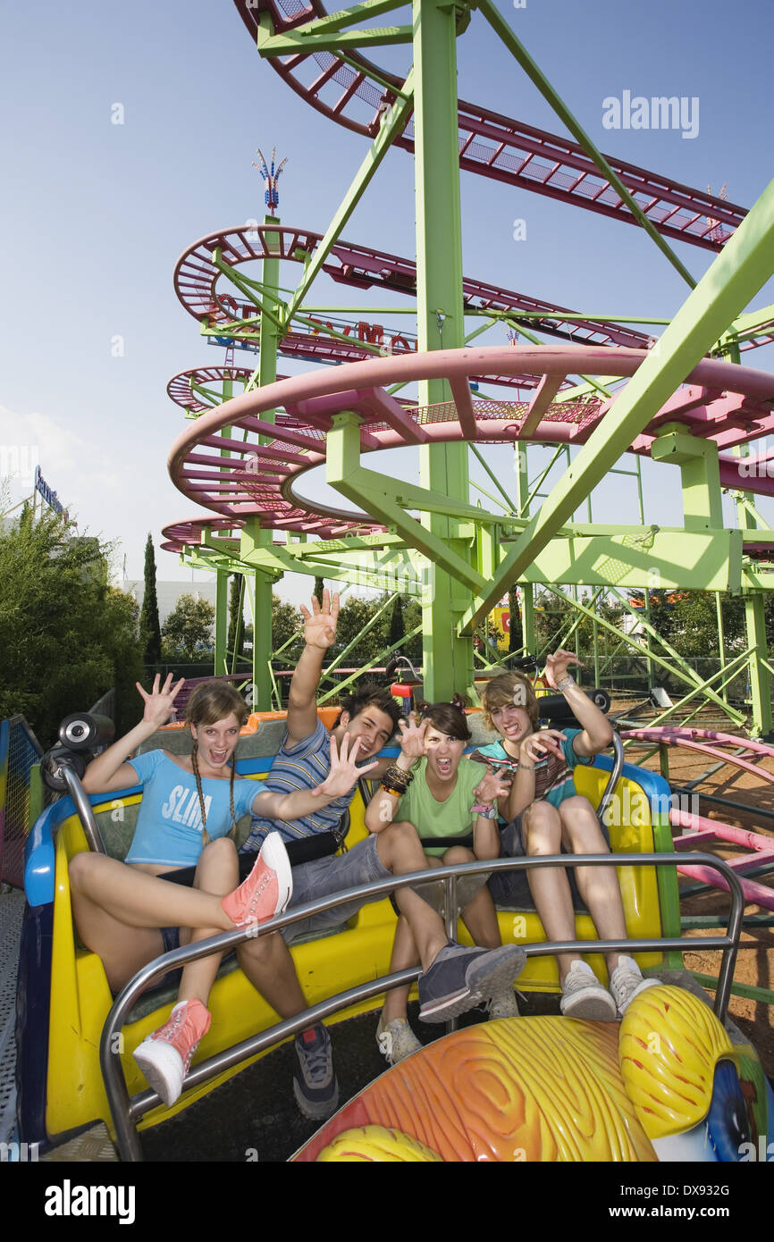 Teenagers on amusement park ride Stock Photo - Alamy