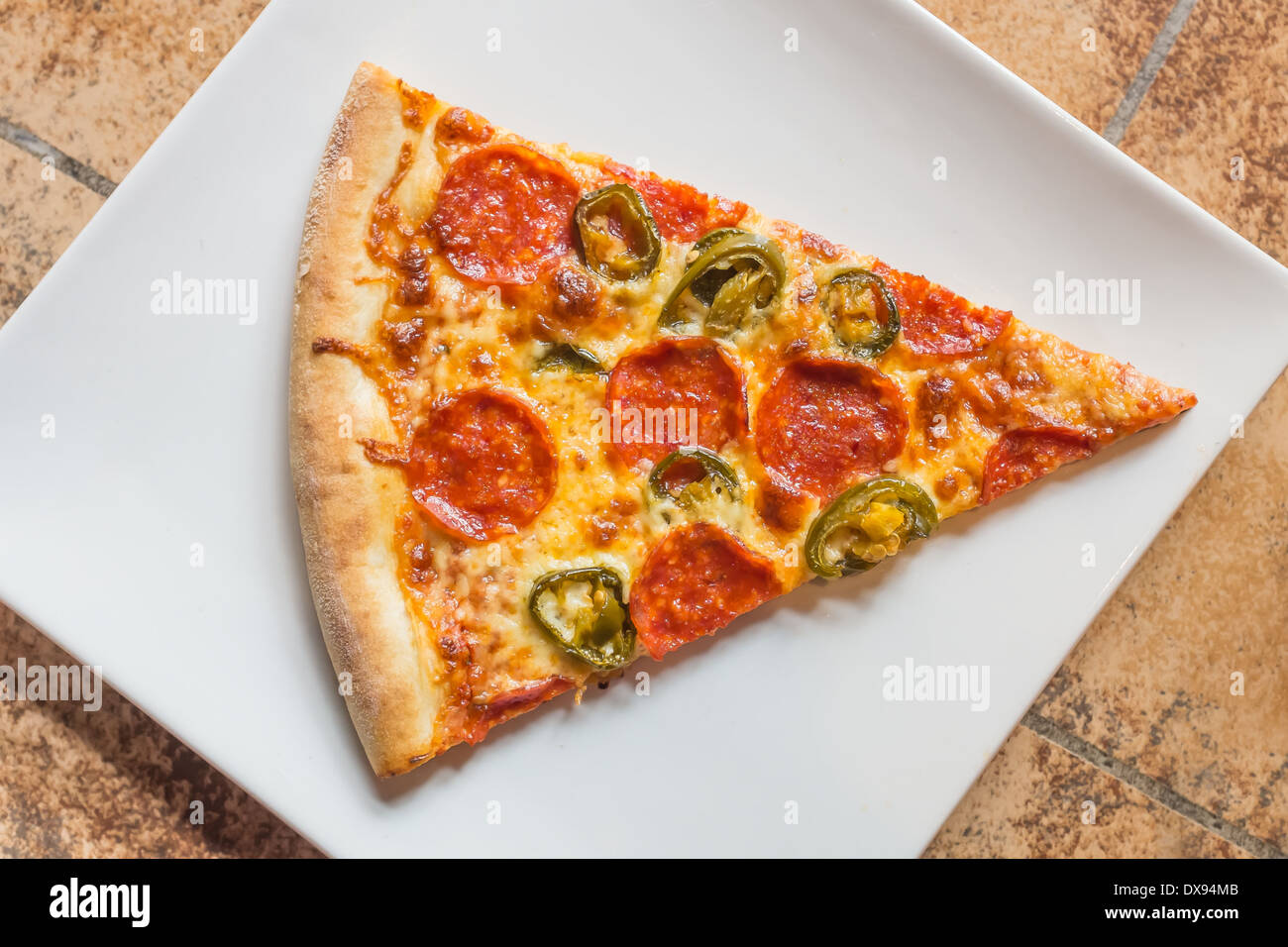 Closeup view of a slice of a pepperoni pizza Stock Photo - Alamy