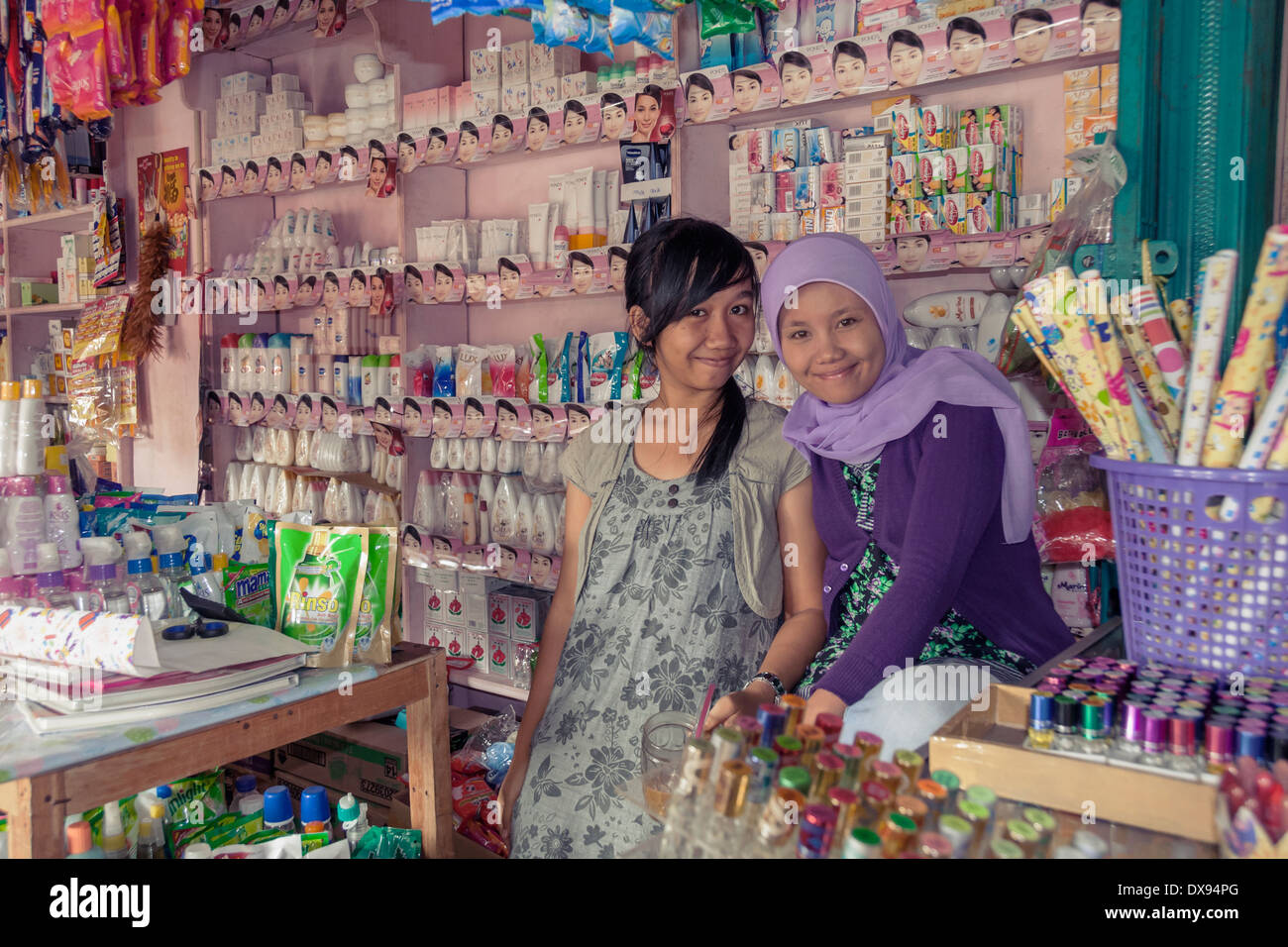 Pair of shop girls in a drug store, Bengkulu market, Southwest Sumatra ...
