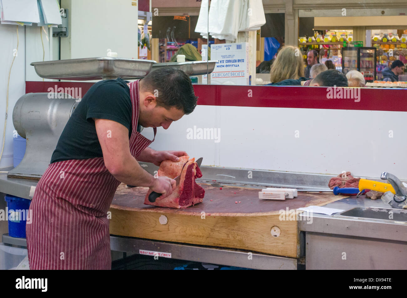 A butcher cuts into beef Stock Photo - Alamy