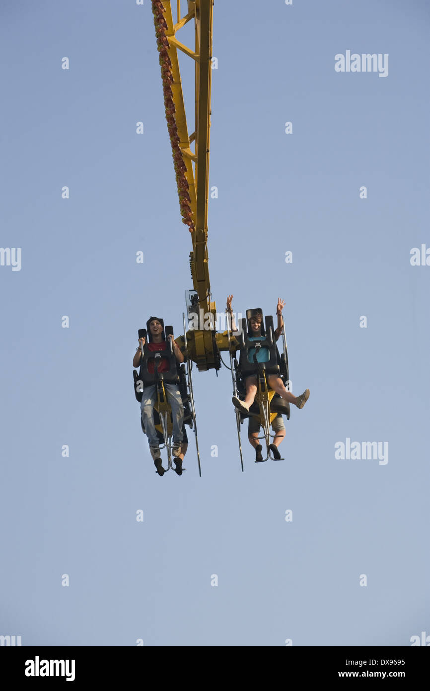 Teenagers on amusement park ride Stock Photo - Alamy