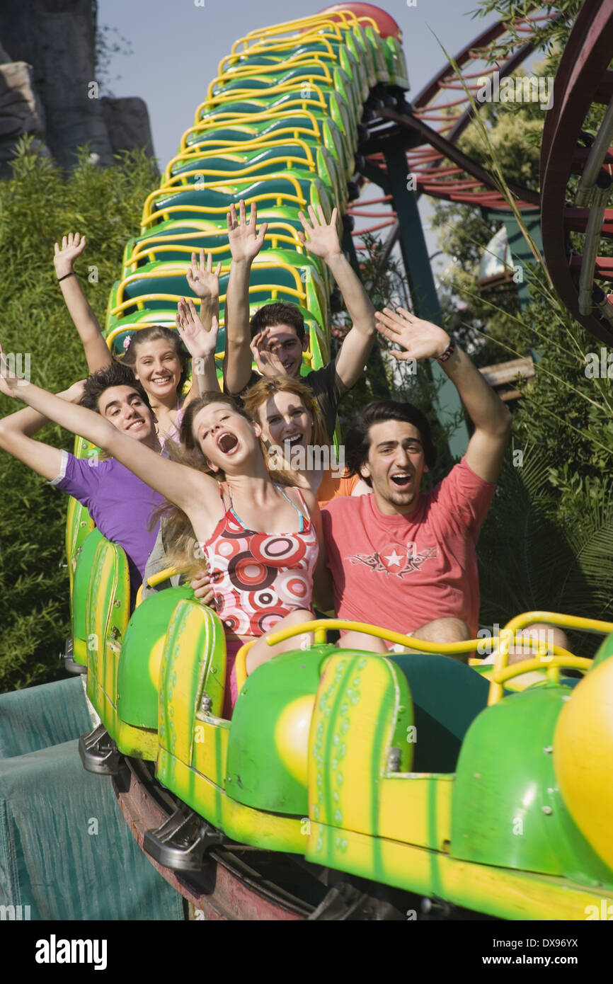 Teenagers on amusement park ride Stock Photo - Alamy