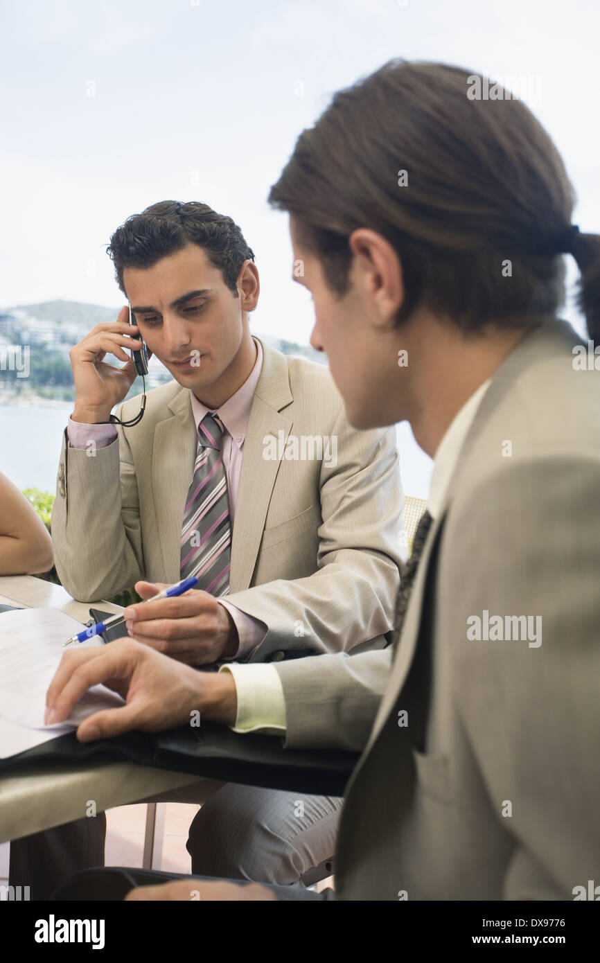 Two men at a meeting by the sea Stock Photo - Alamy