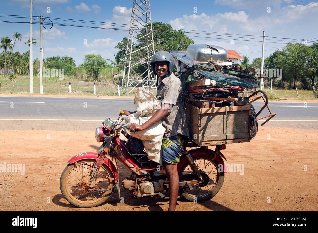 Riding an overloaded scooter hi-res stock photography and images - Alamy