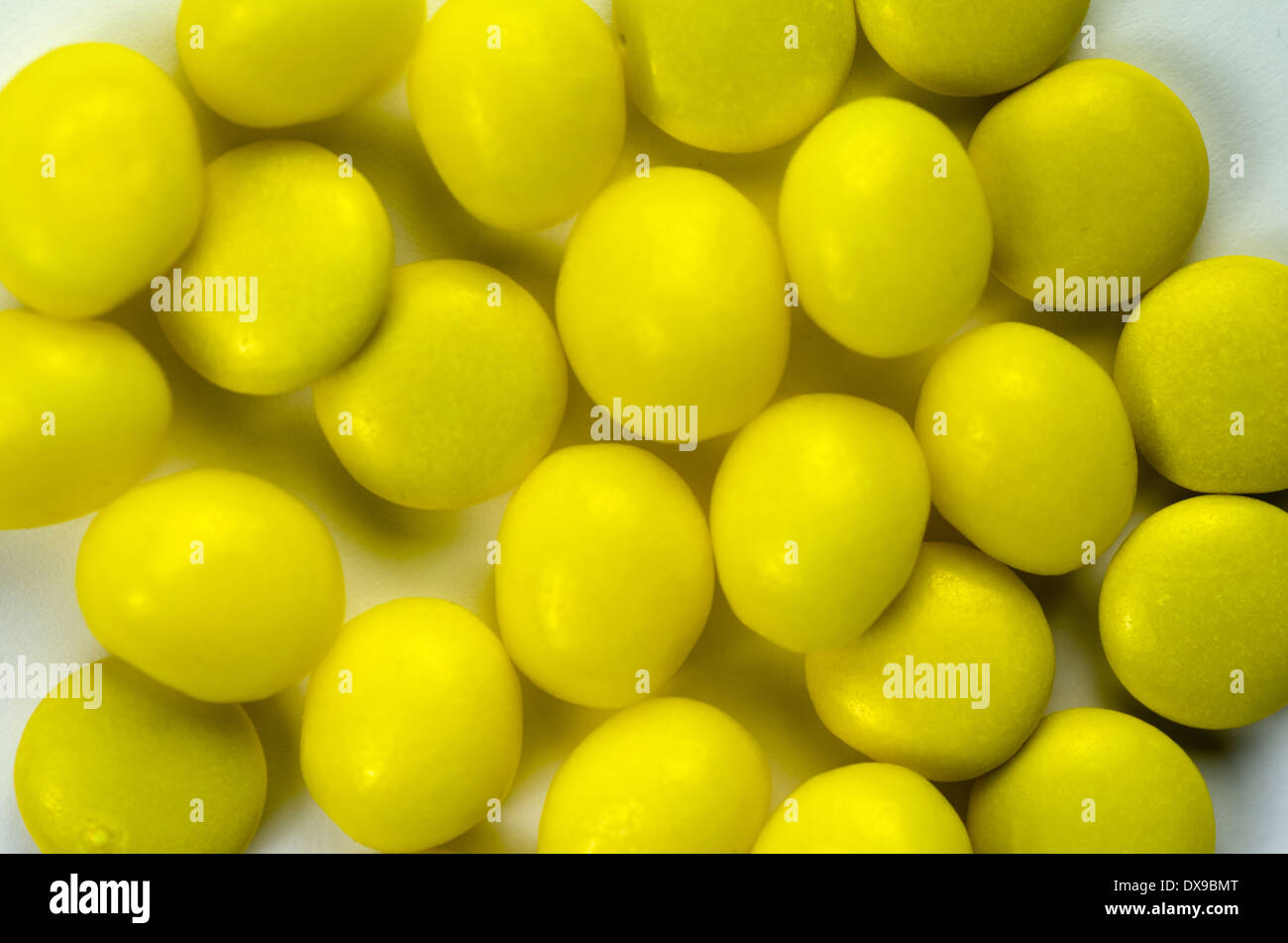 Bunch of yellow candy Stock Photo - Alamy