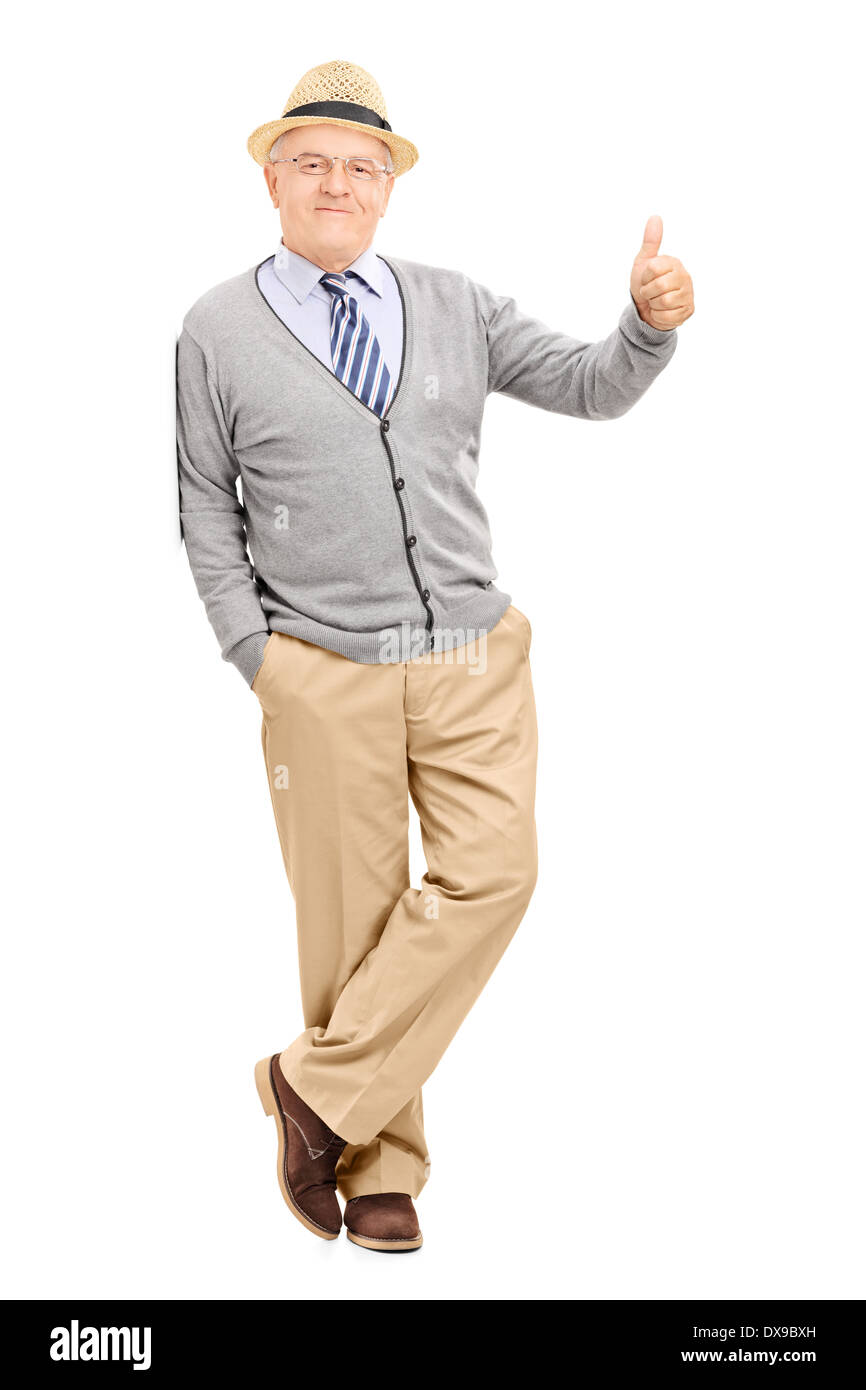 Old man leaning against wall hi-res stock photography and images - Alamy