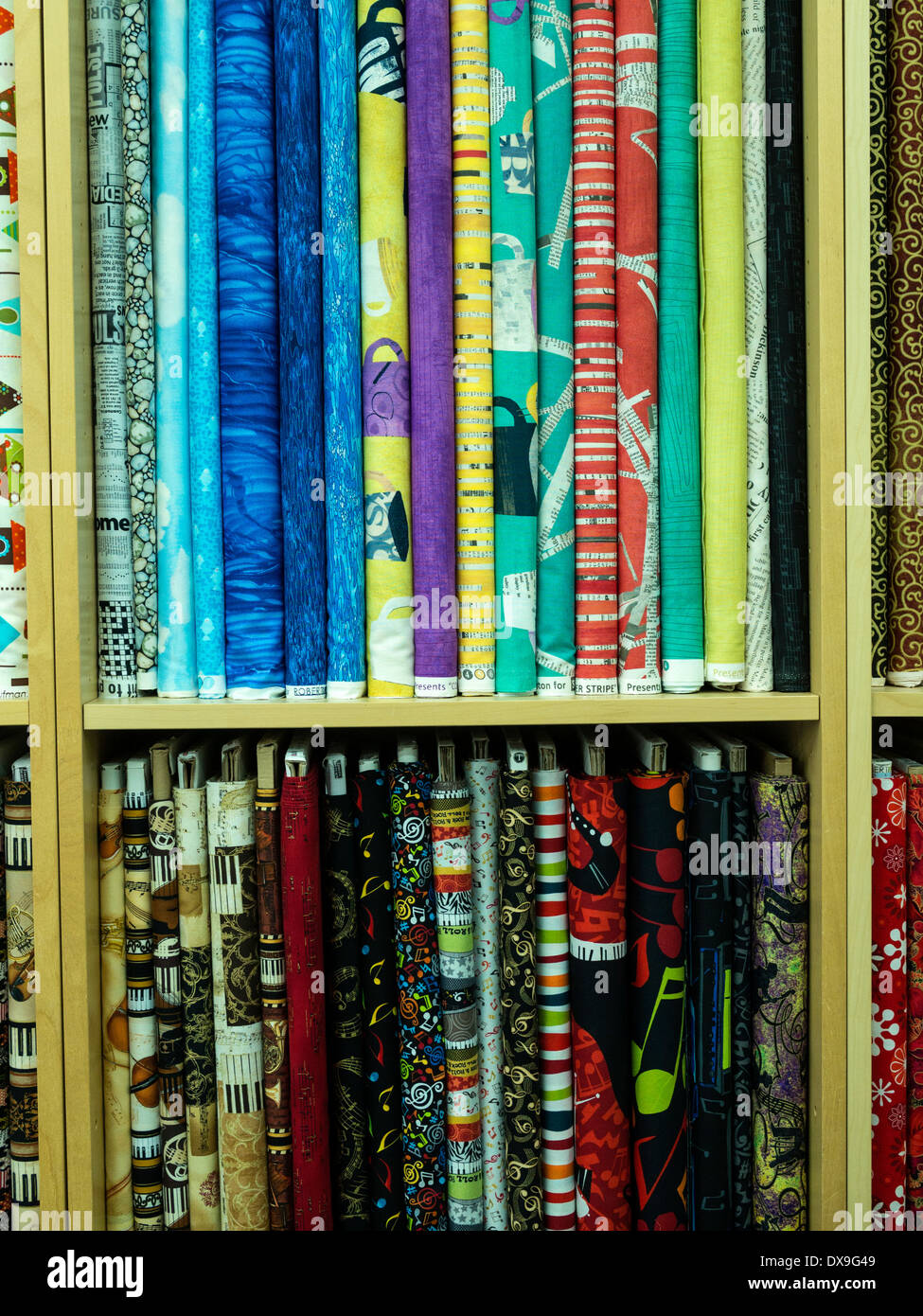 racks of dress making material in a shop Stock Photo - Alamy