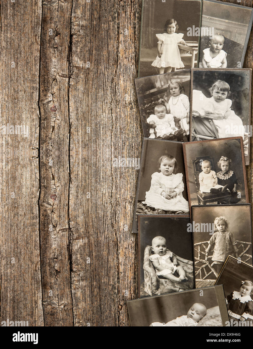 old baby pictures on rustic wooden background. vintage nostalgic ...