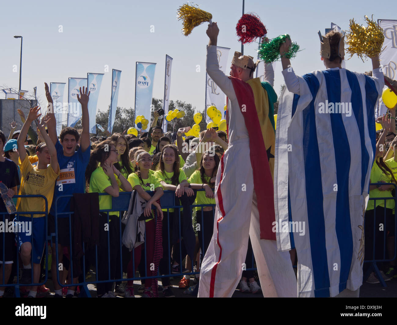 Jerusalem, Israel. 21st Mar, 2014. Clowns on stilts and puppets ...