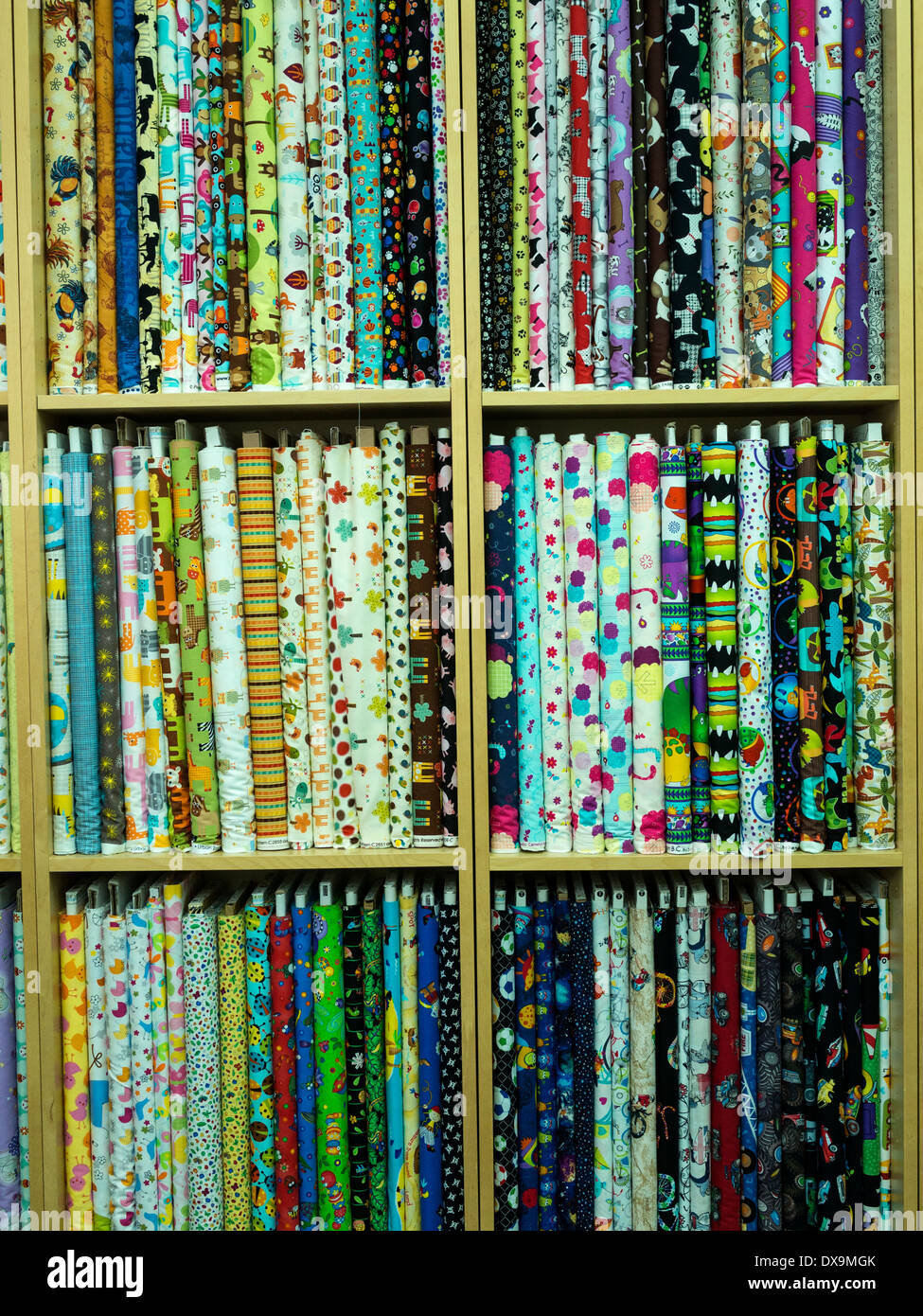 racks of dress making material in a shop Stock Photo - Alamy