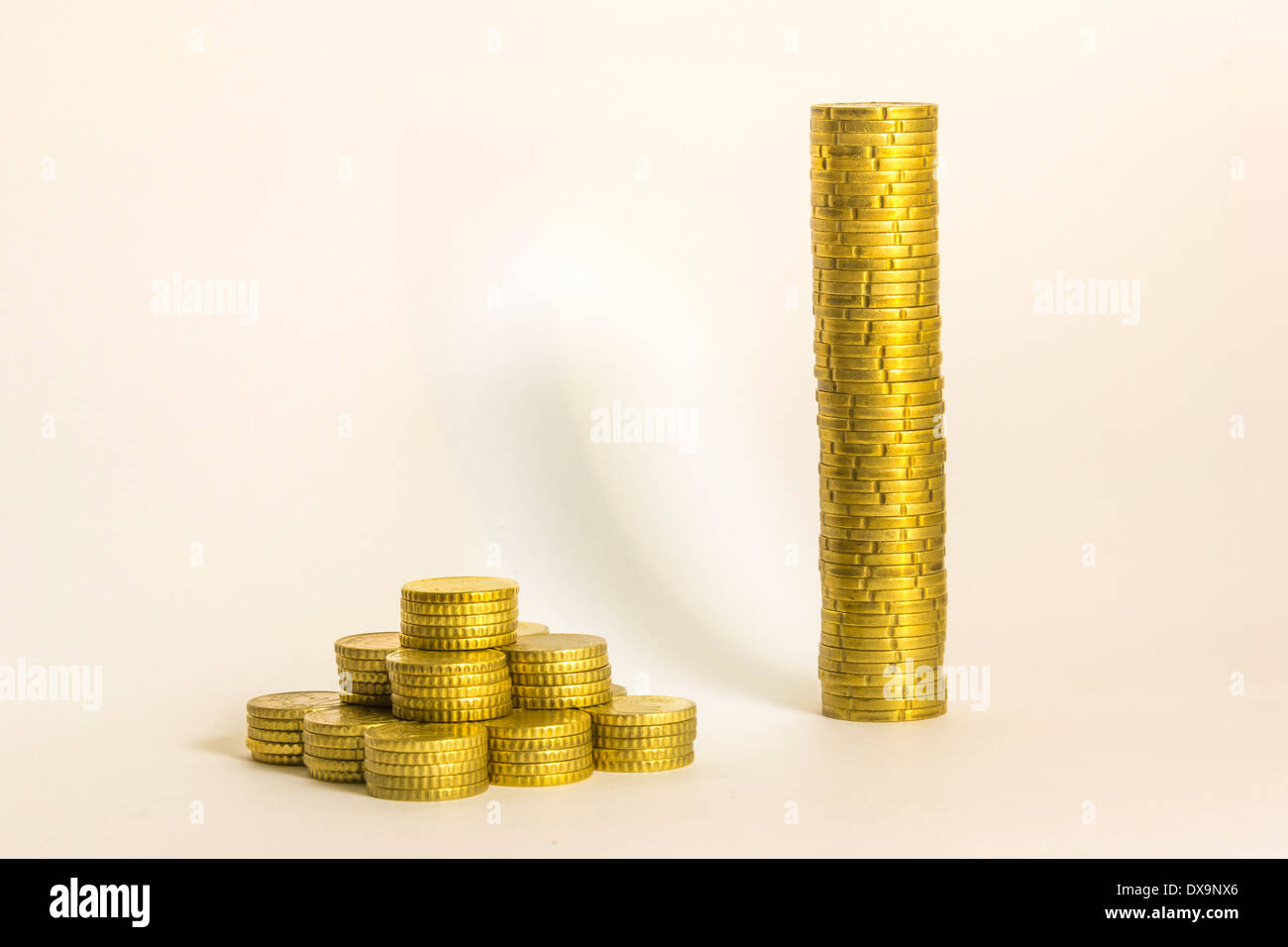 Yellow coins in different layout with white background Stock Photo - Alamy
