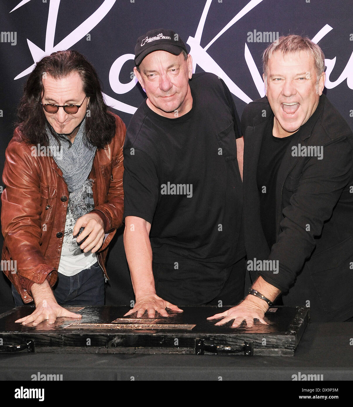 Rock band, Rush (L-R) Geddy Lee, Neil Peart, Alex Lifeson are honored on Guitar Center's ...