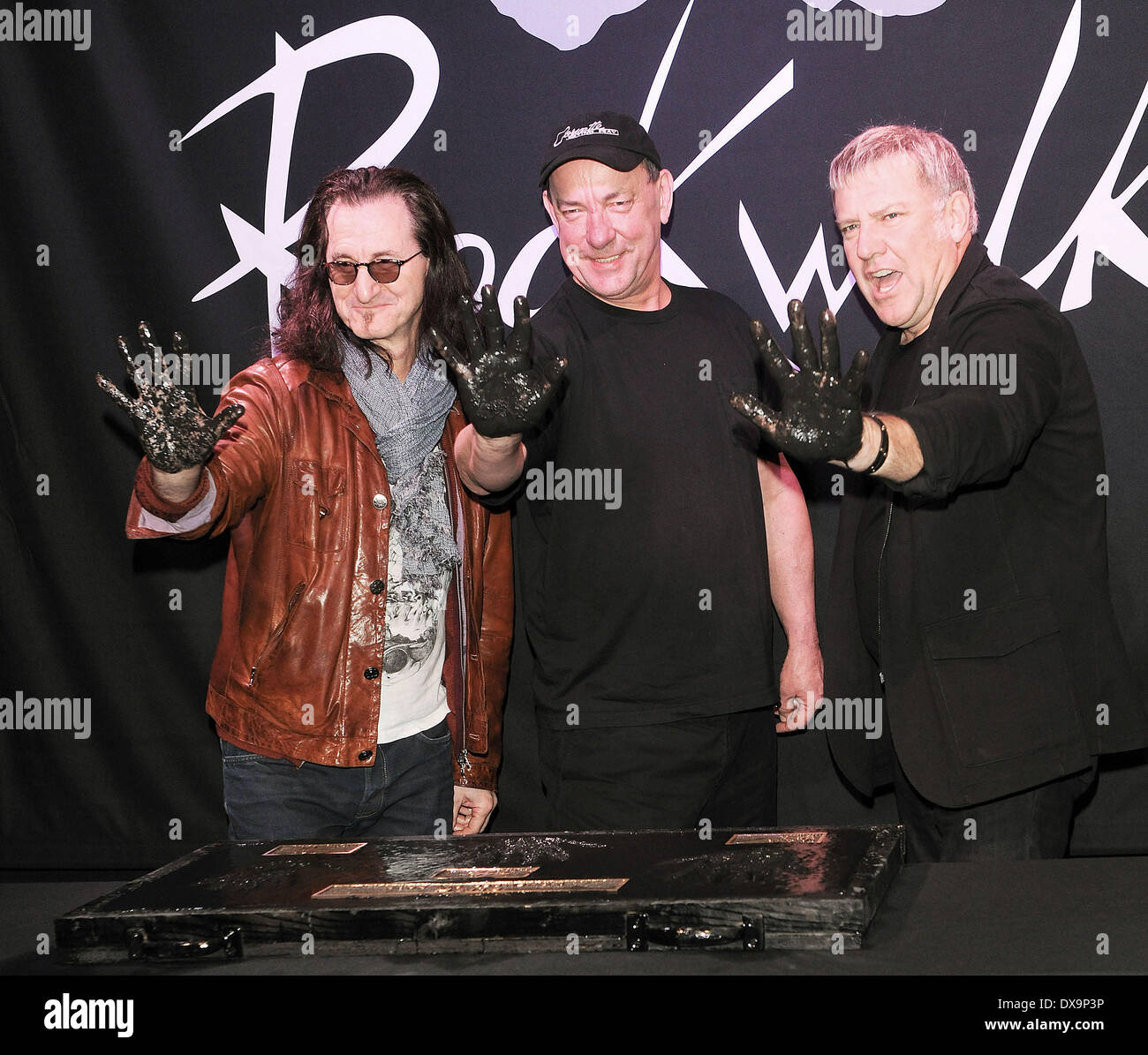 Rock band, Rush (L-R) Geddy Lee, Neil Peart, Alex Lifeson are honored on Guitar Center's ...
