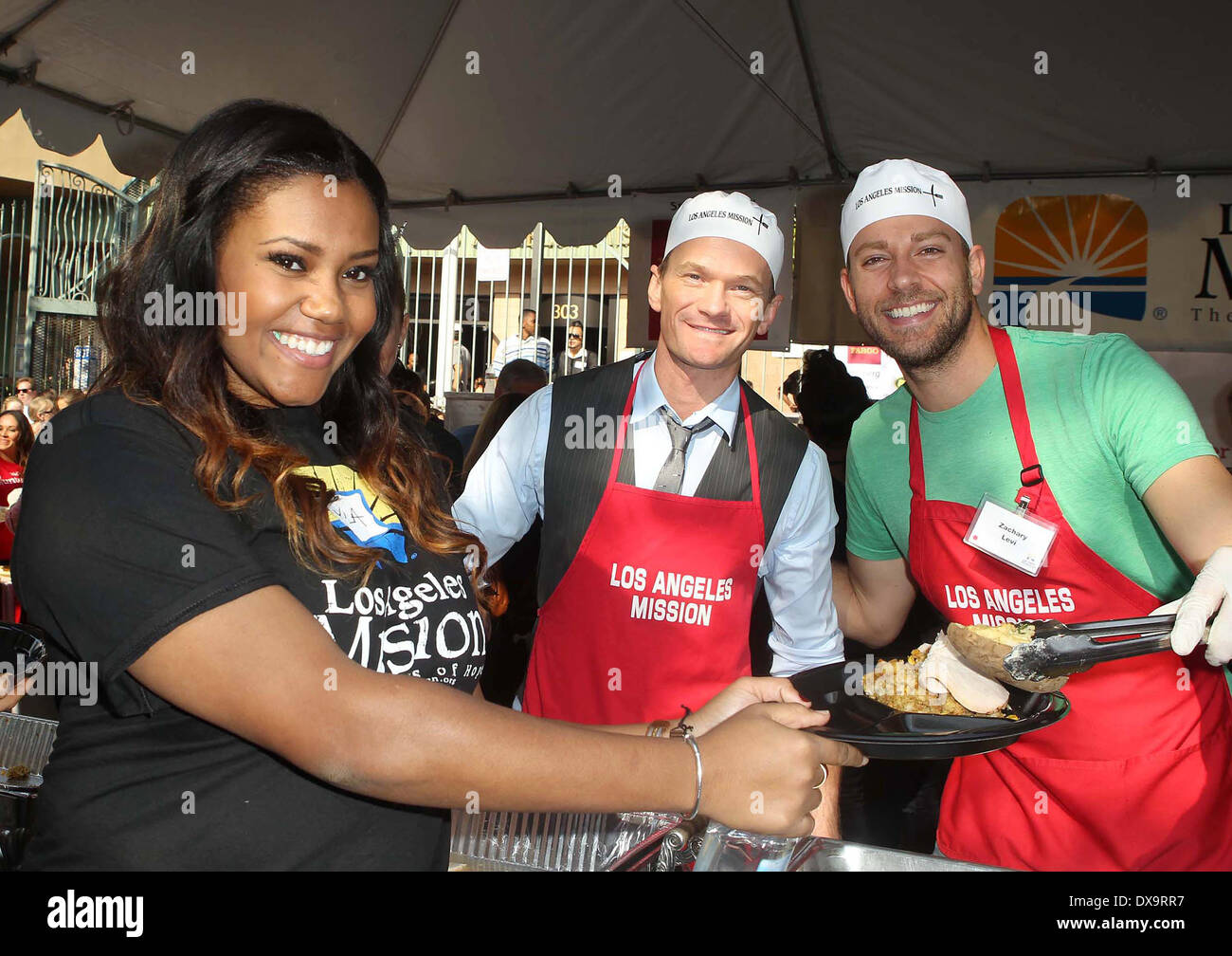 Neil Patrick Harris, Zachary Levi and Guest, at the Los Angeles Mission's Thanksgiving for skid ...