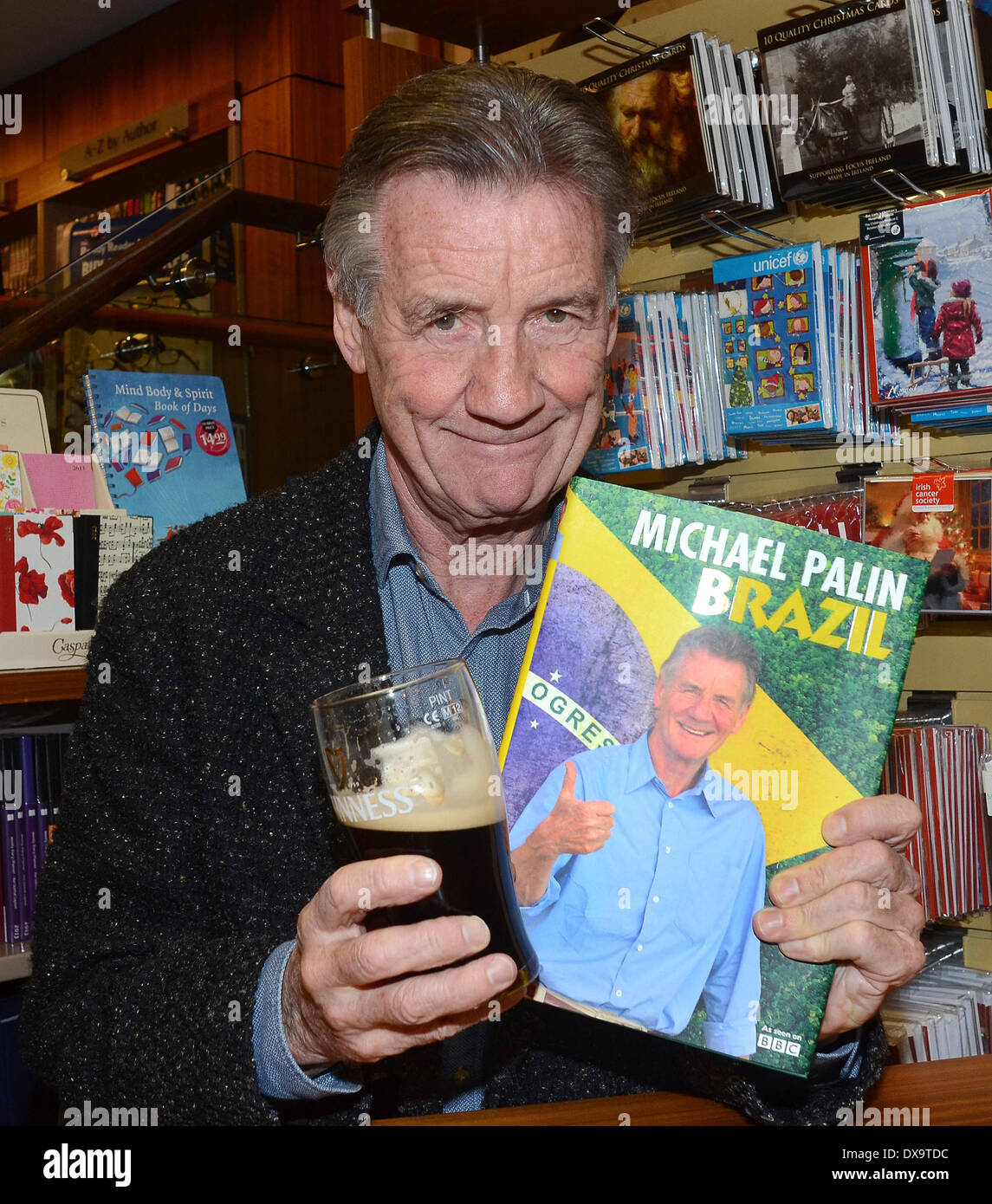 Michael Palin enjoys a pint of Guinness as he signs copies of his book ...