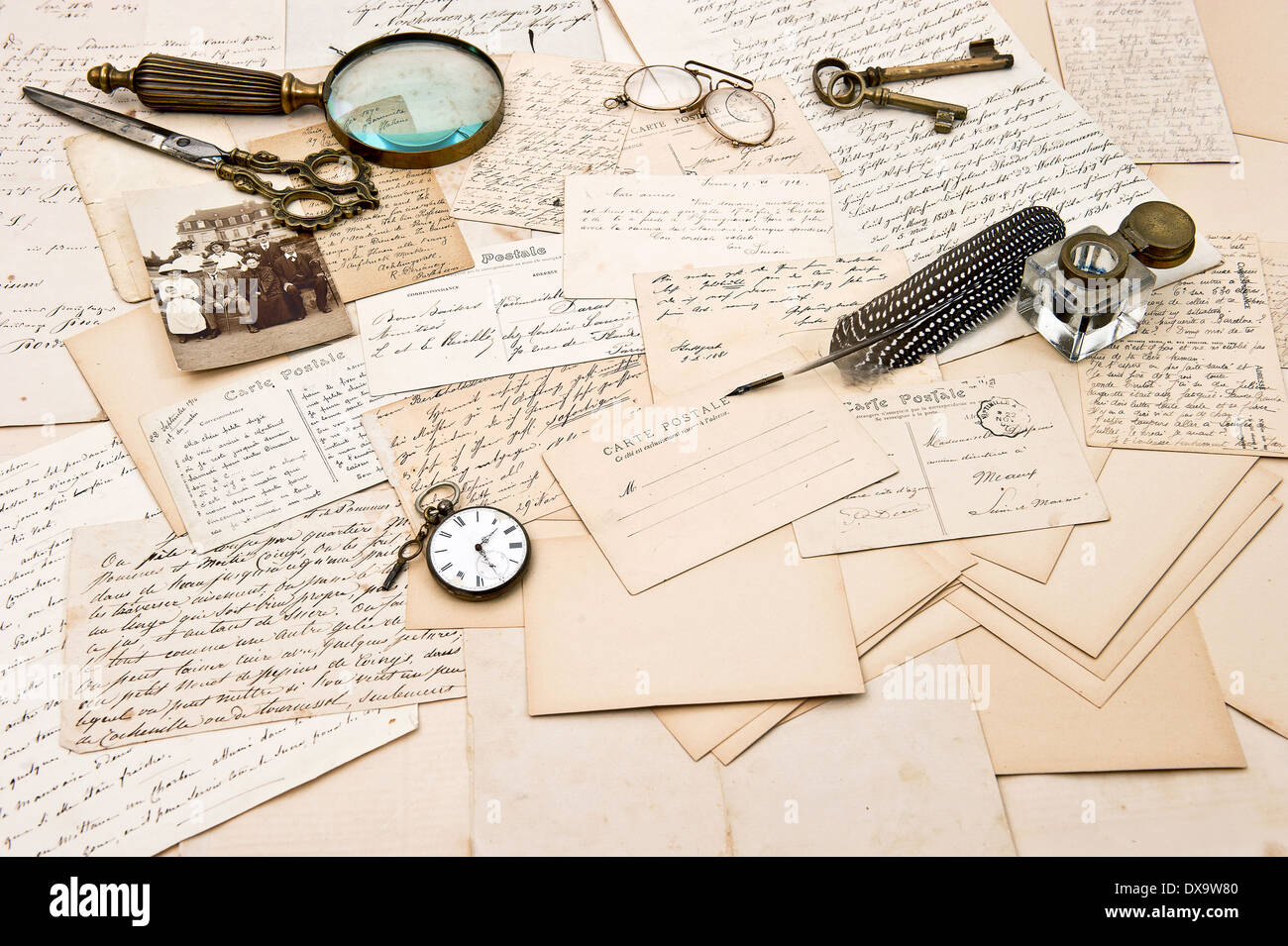 old letters, postcards, vintage accessory and photo of a family. retro ...