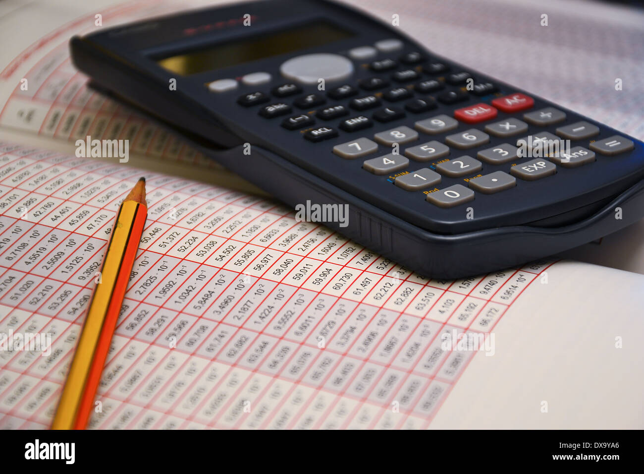 analyze data with calculator and pencil Stock Photo - Alamy