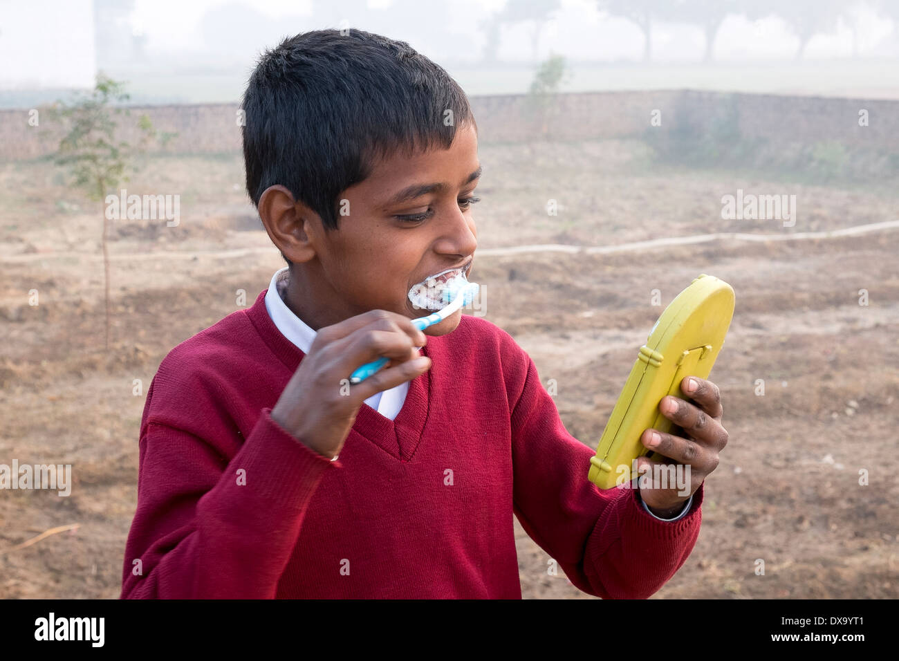 Child brushing teeth school uniform hi-res stock photography and images ...