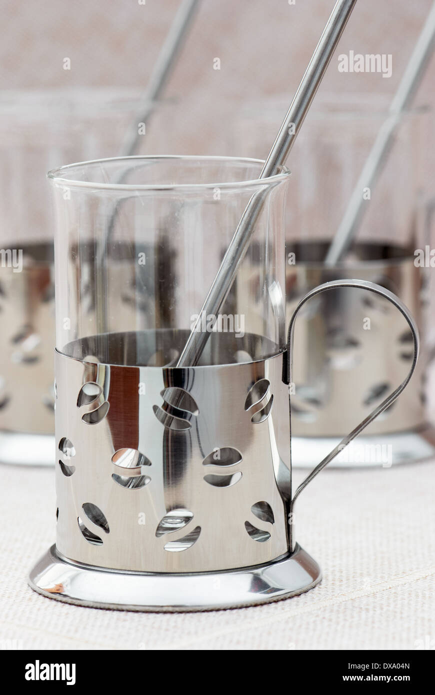 Shiny ornate cups in a steel frame Stock Photo - Alamy