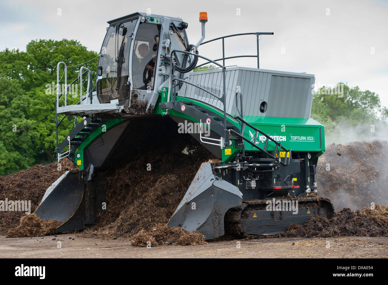 Komptech self propelled compost turner, turning over rotting bedding ...