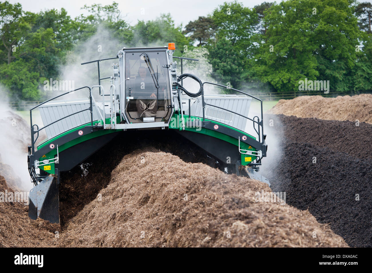 Komptech self propelled compost turner, turning over rotting bedding ...