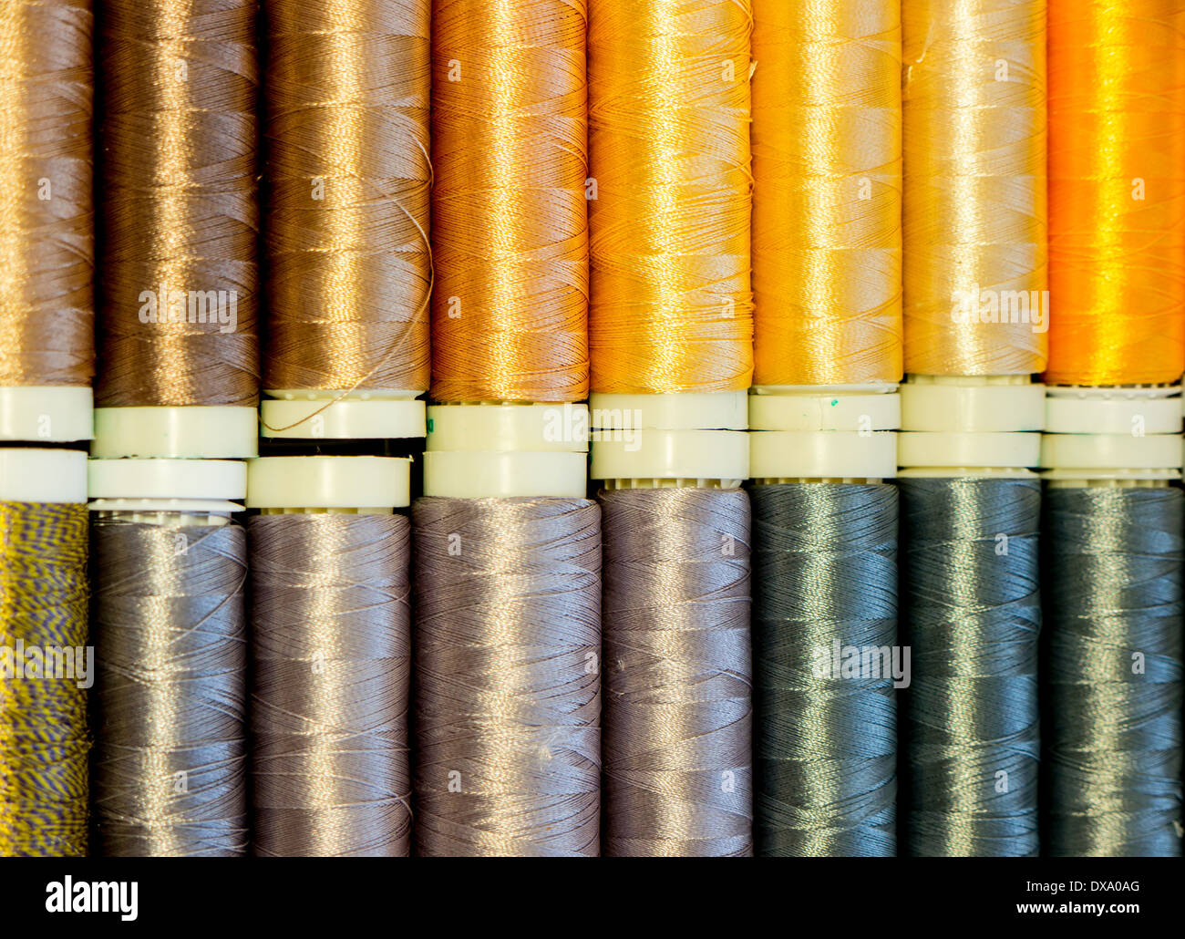 Colored spools of threads Stock Photo - Alamy