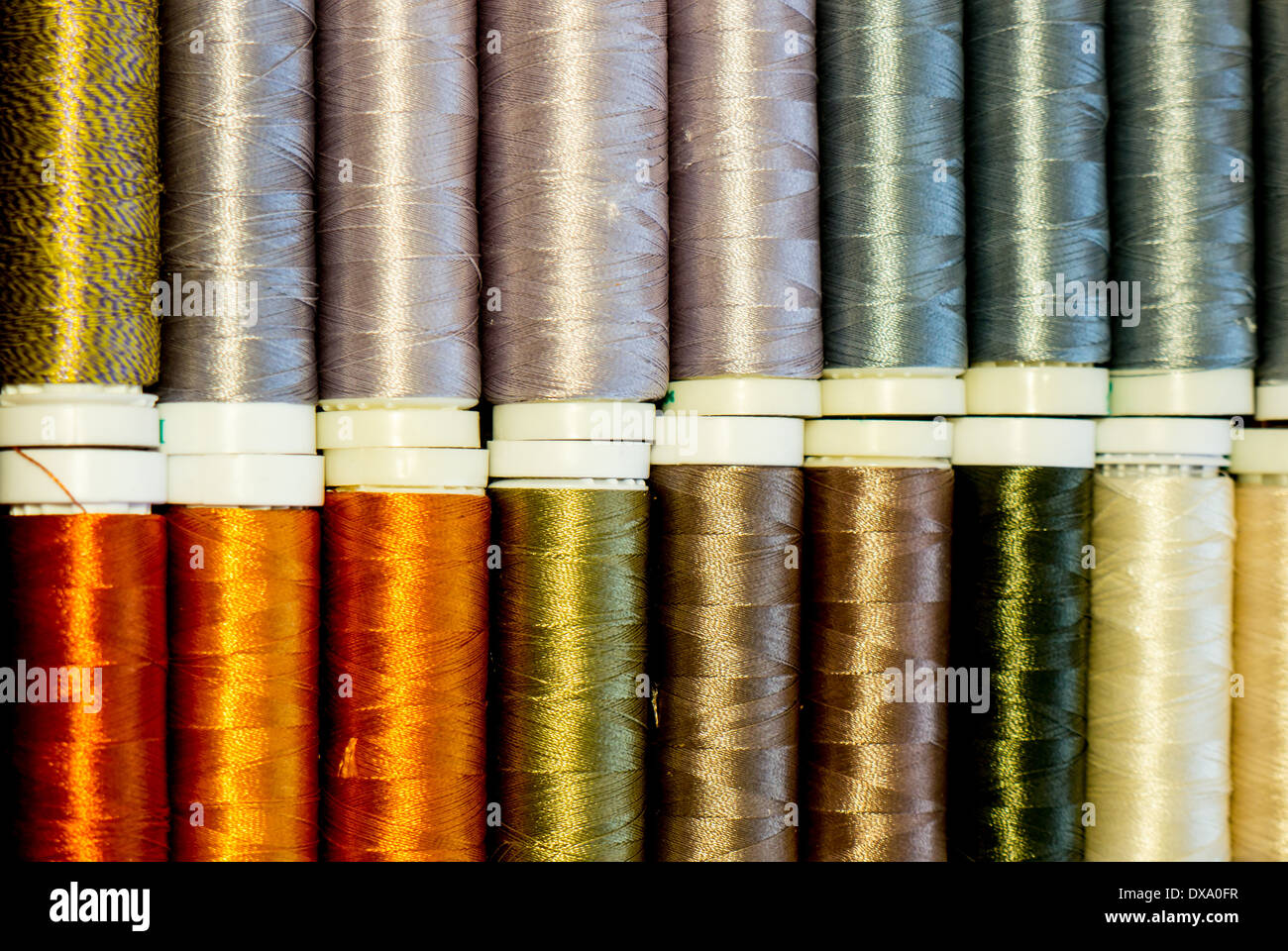 Colored spools of threads Stock Photo - Alamy