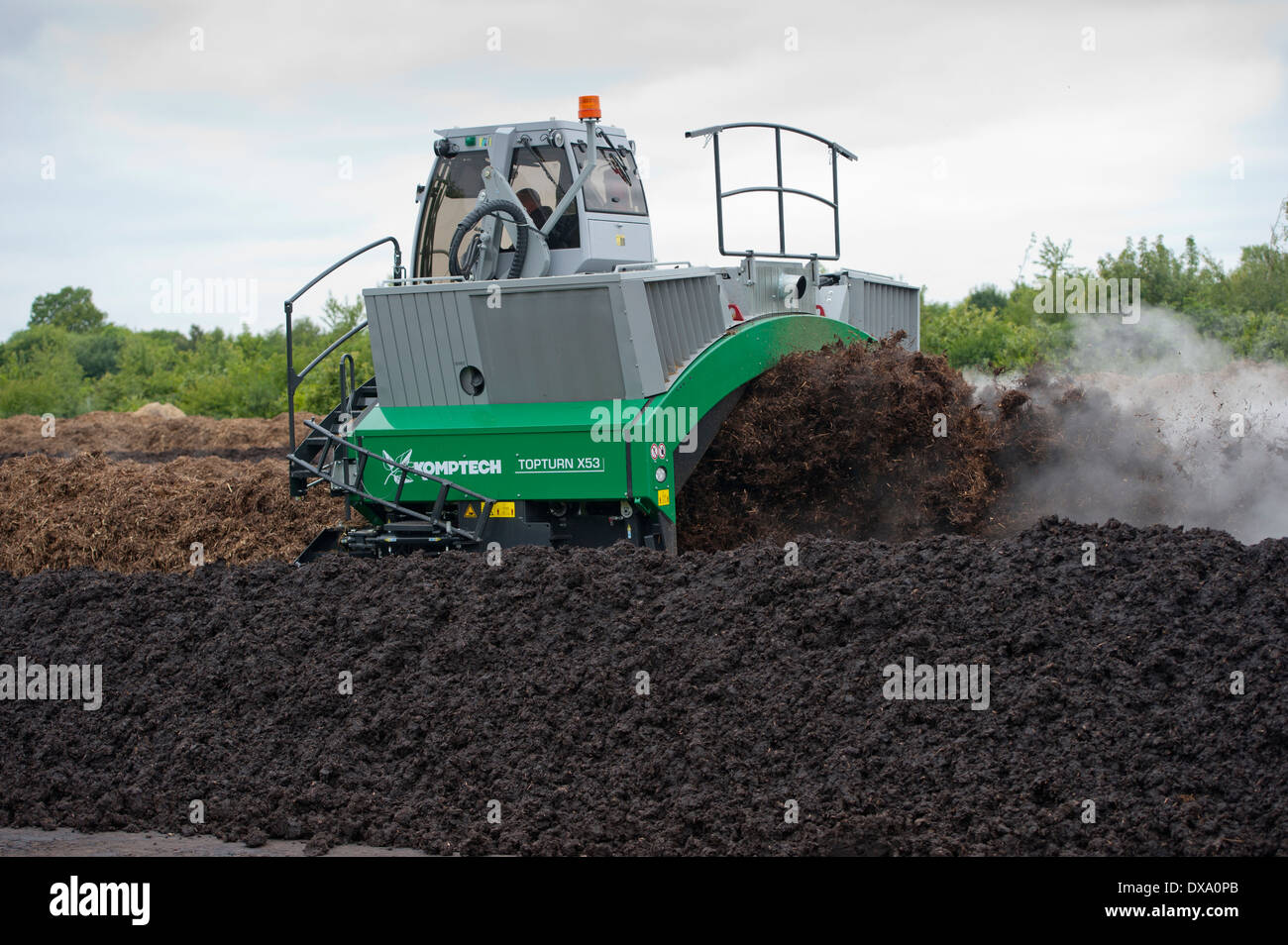 Komptech self propelled compost turner, turning over rotting bedding ...