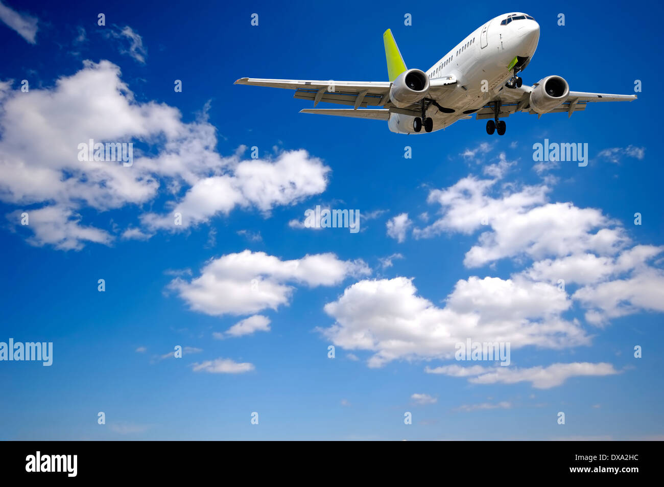 Air plane is flying. With blue and cloudy sky Stock Photo - Alamy