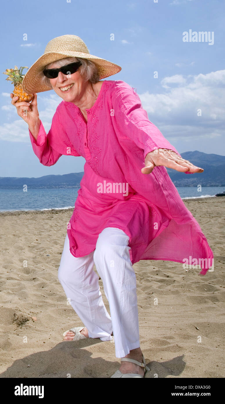 Female senior on the beach Stock Photo - Alamy