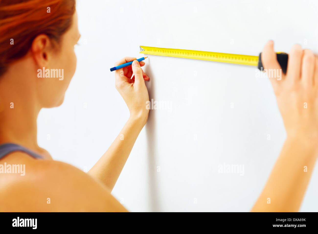 Woman with ruler hi-res stock photography and images - Alamy