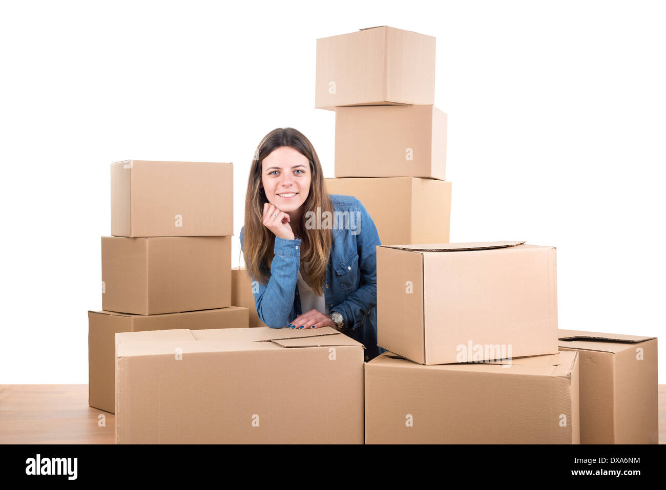 Beautiful girl with cardboard boxes unpacking in new home Stock Photo ...